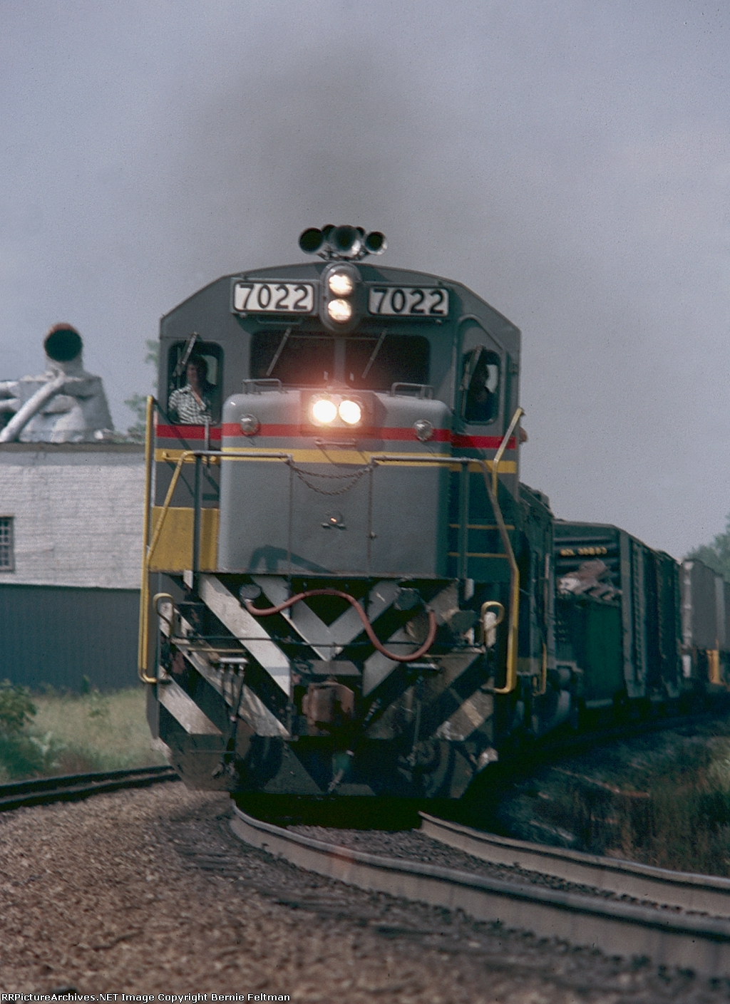 SCL C30-7 #7022, moving SCL train #307 at track speed around the curve at the depot site on the ...